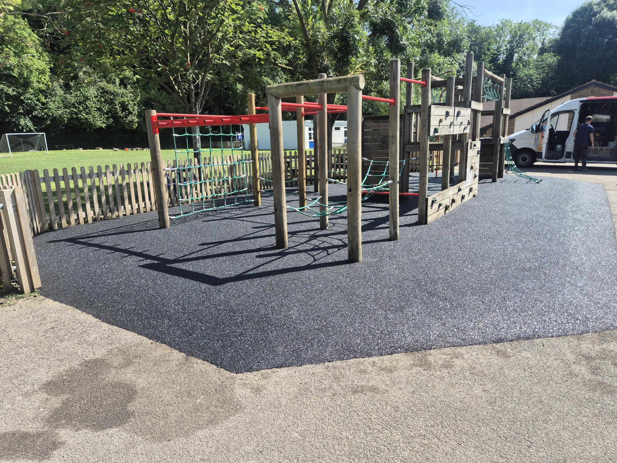 Black wetpour rubber surfacing installed in Hertfordshire - Setter Play